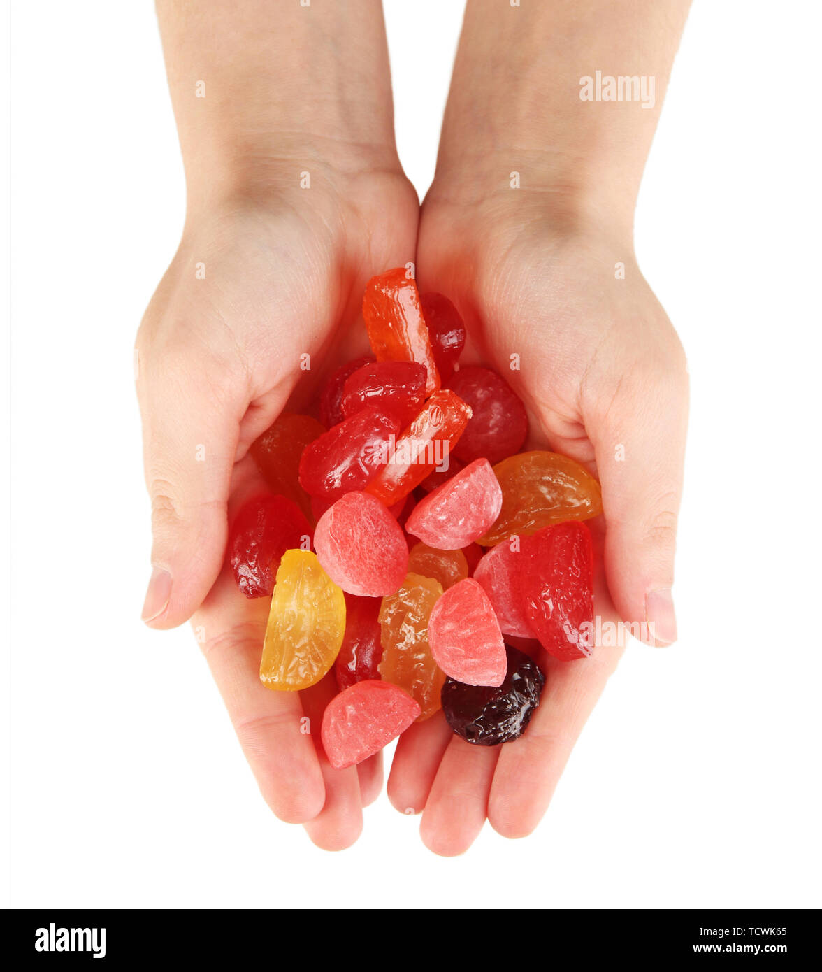 Hands full of sweets isolated on white Stock Photo - Alamy