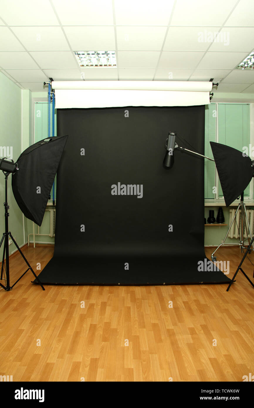 Empty photo studio with lighting equipment Stock Photo - Alamy