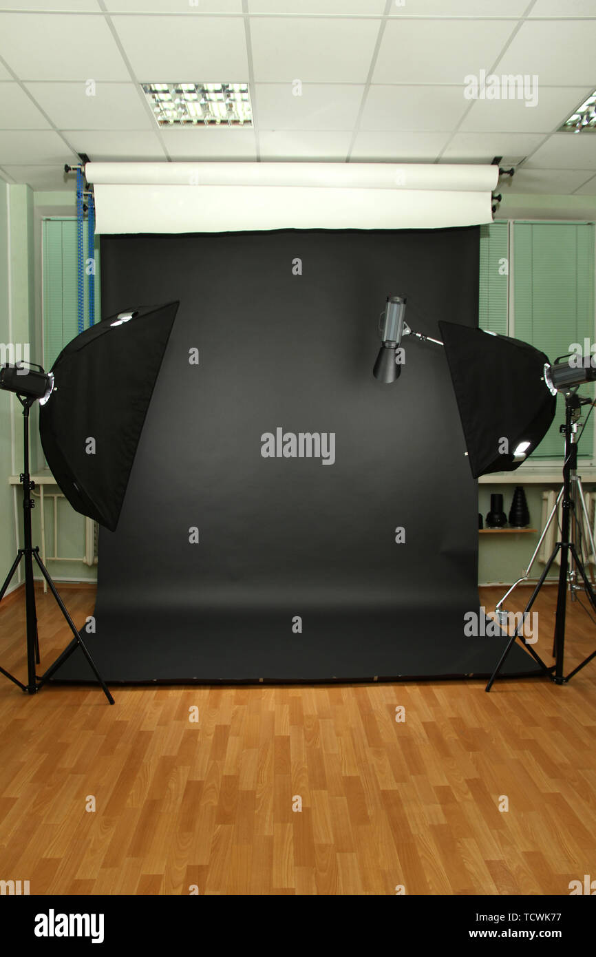 Empty photo studio with lighting equipment Stock Photo - Alamy