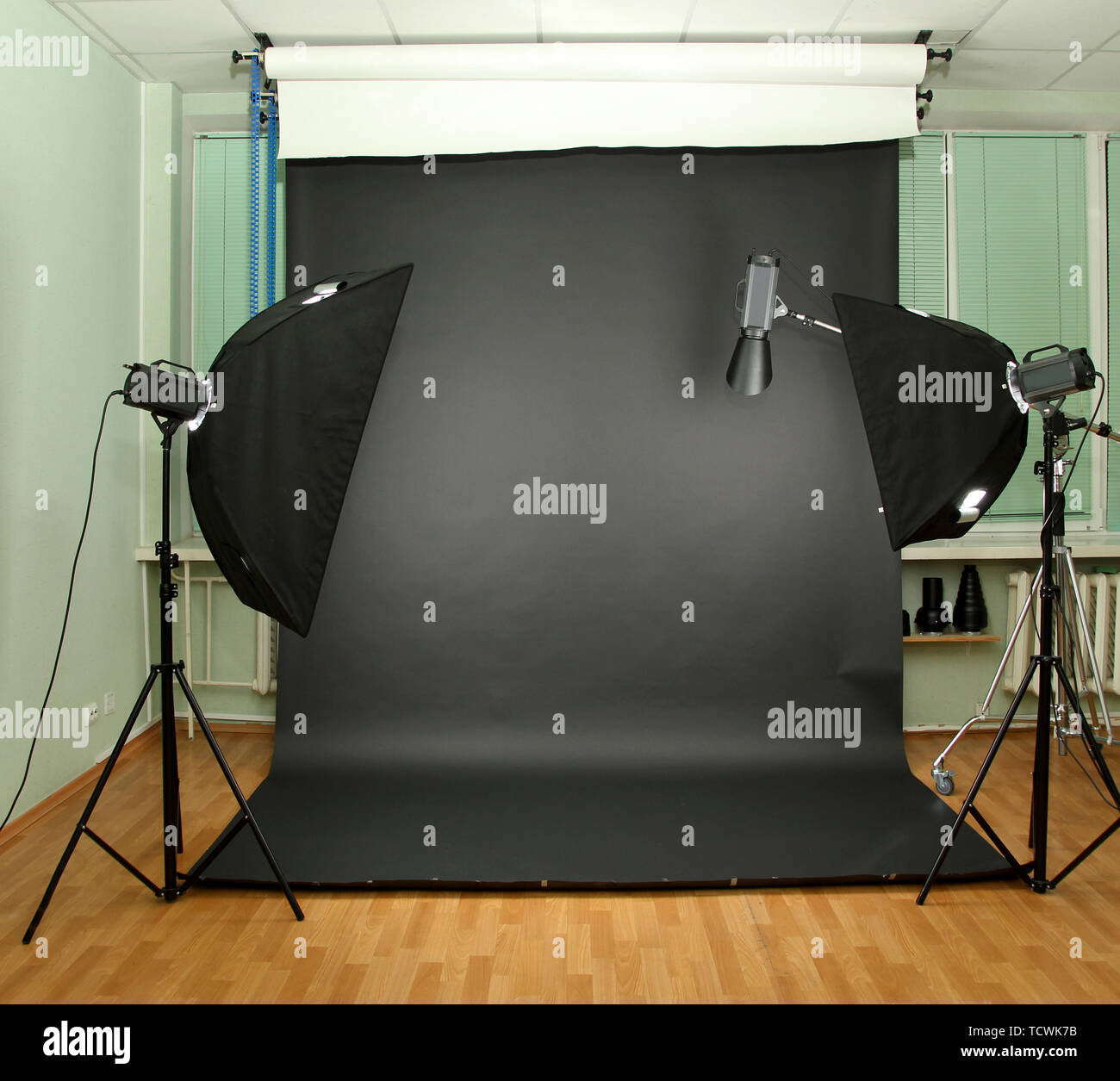 Empty photo studio with lighting equipment Stock Photo - Alamy