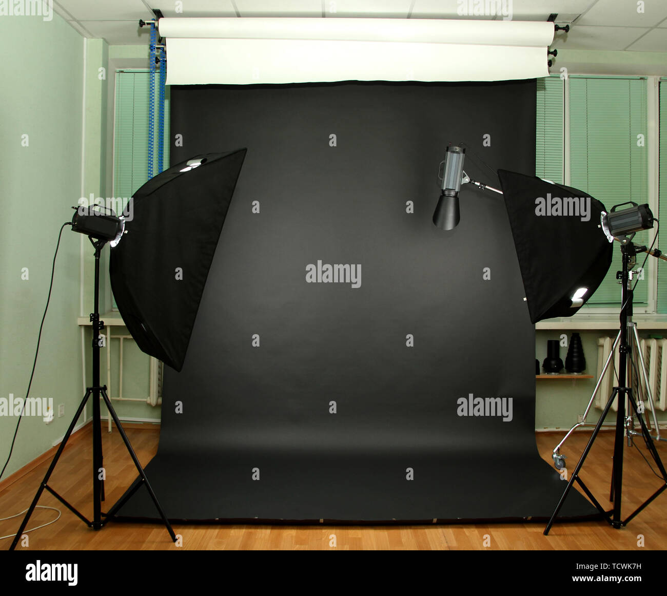 Empty photo studio with lighting equipment Stock Photo - Alamy