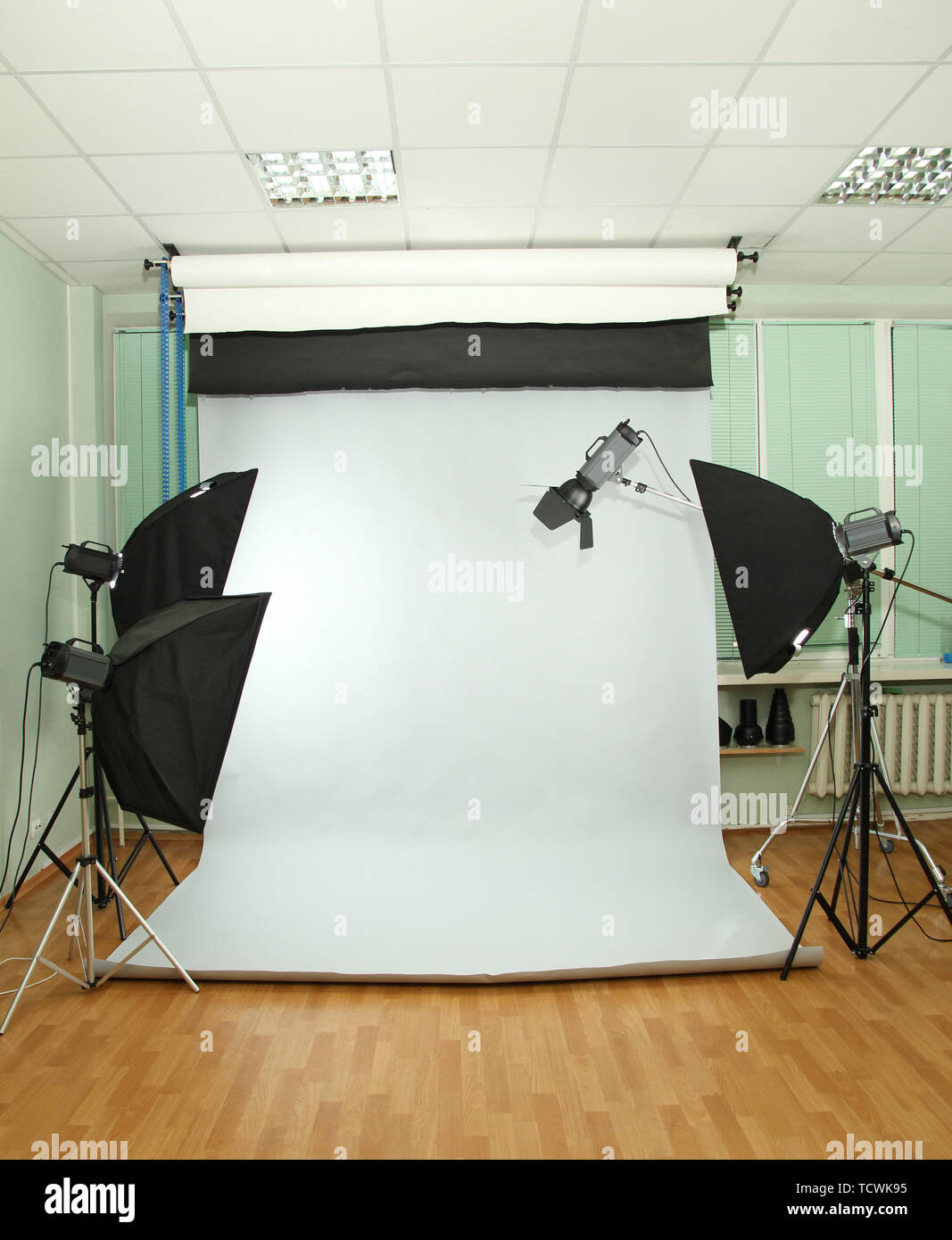 Empty photo studio with lighting equipment Stock Photo - Alamy