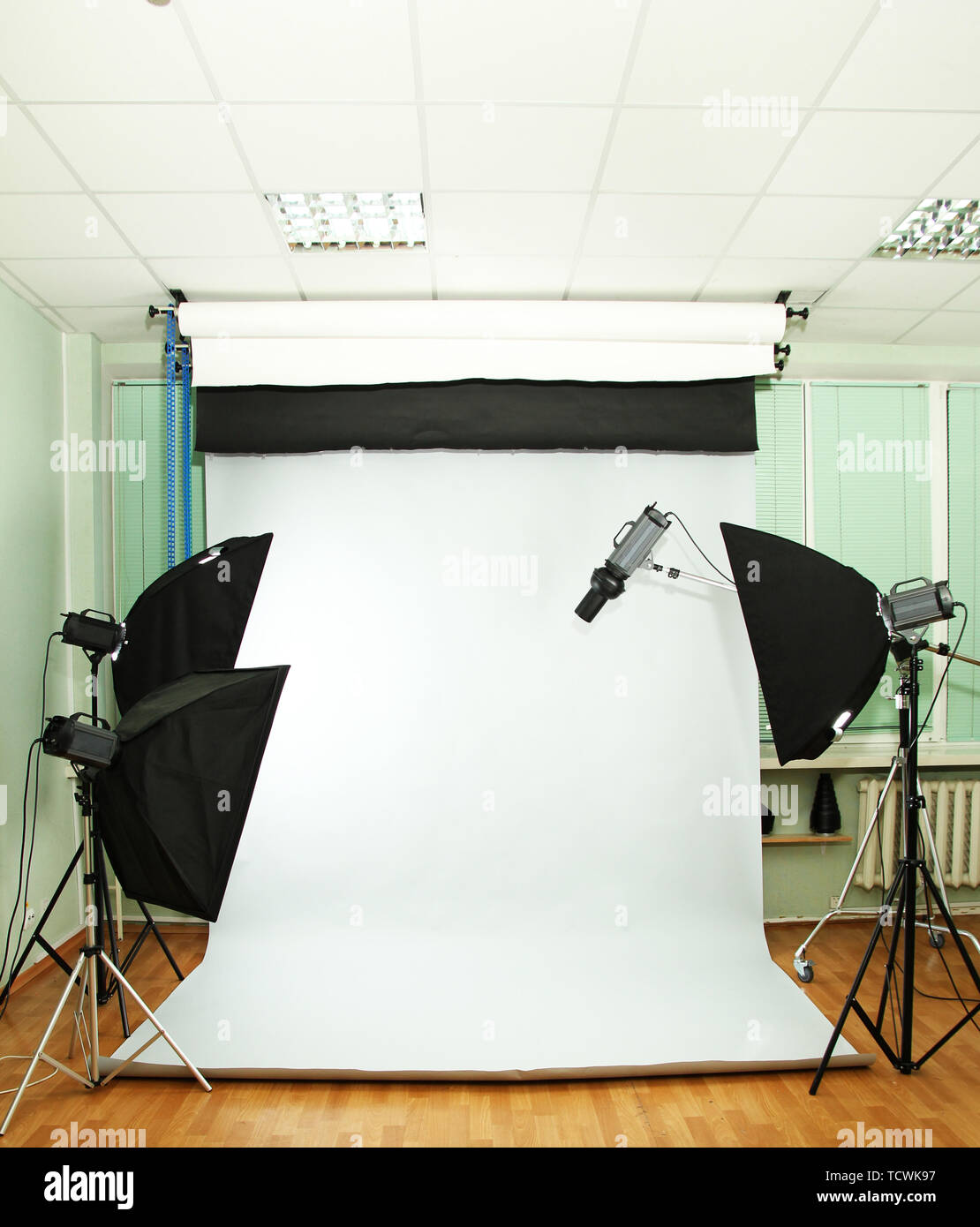 Empty photo studio with lighting equipment Stock Photo - Alamy