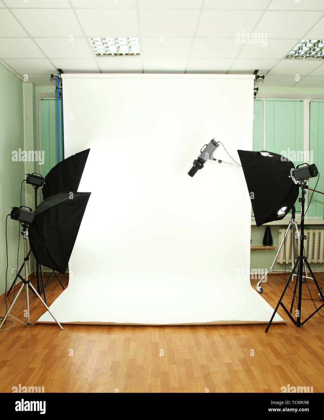 Empty photo studio with lighting equipment Stock Photo - Alamy