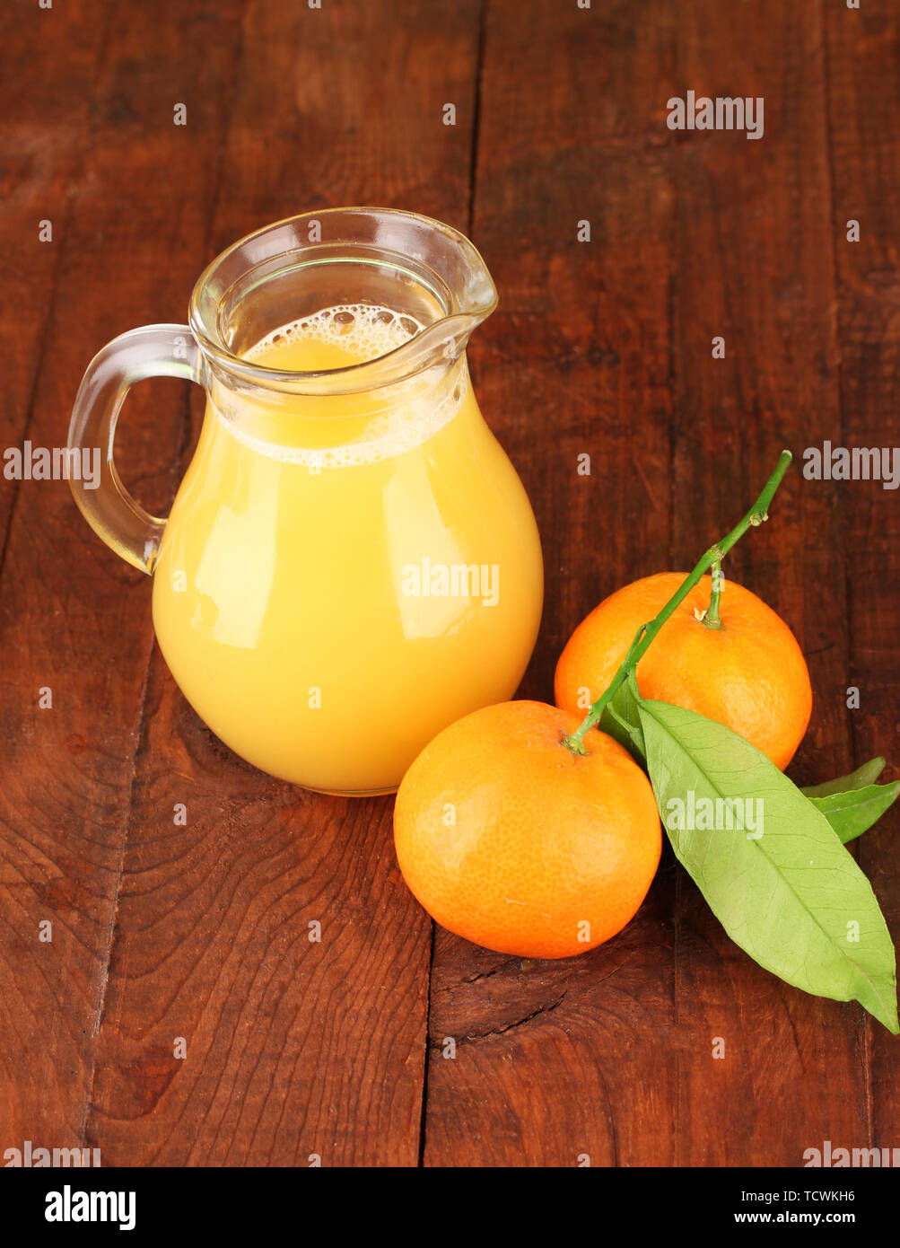 Full jug of orange juice, on wooden background Stock Photo - Alamy