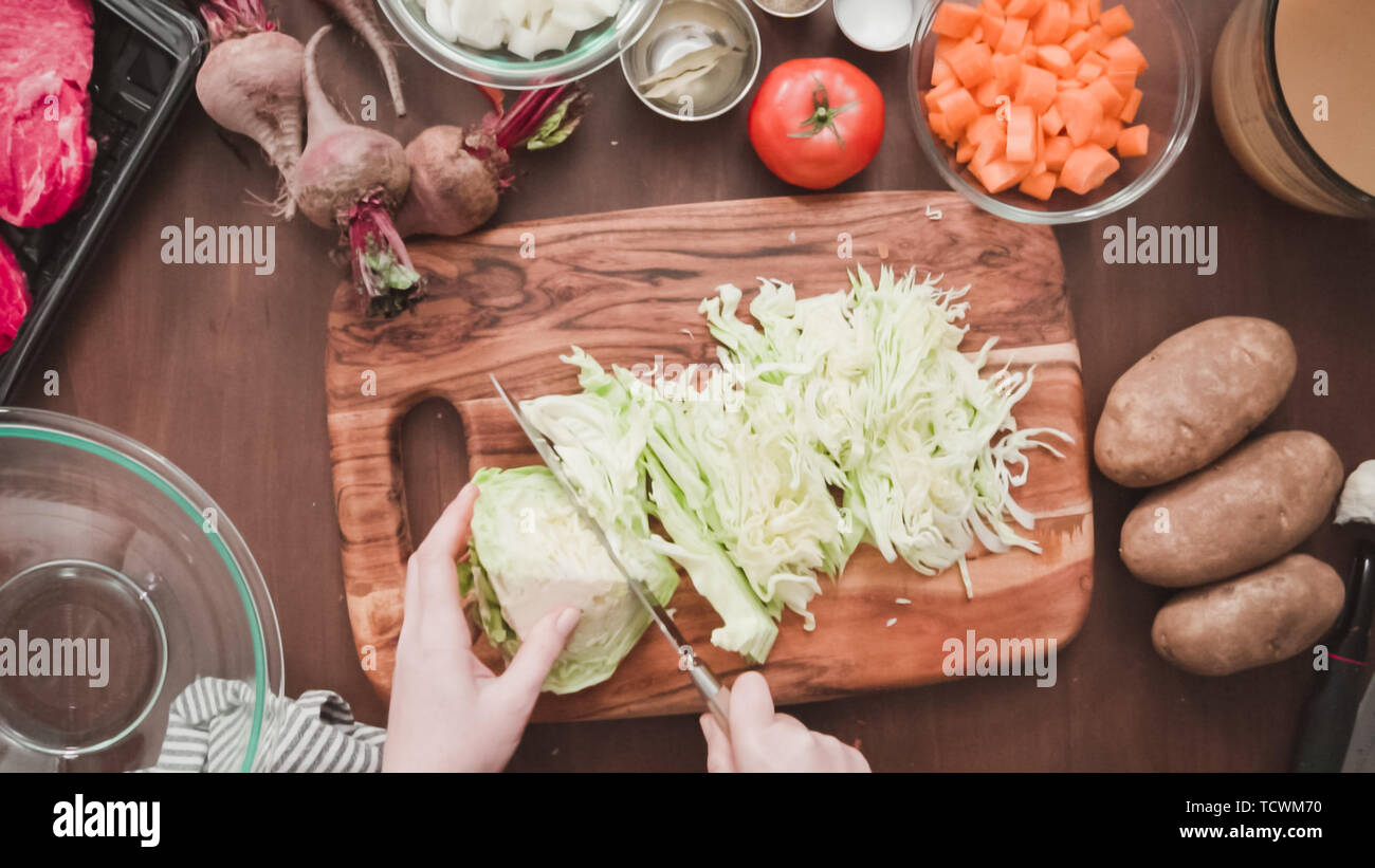 Step by step. Flat lay. Shredding green cabbage for beet soup, borscht ...