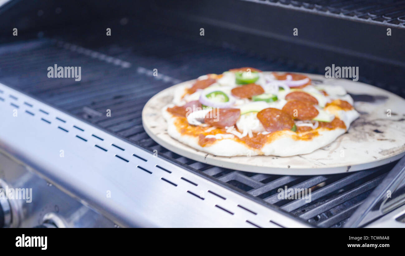 Cooking pizza on outdoor gas hi-res stock photography and images - Alamy