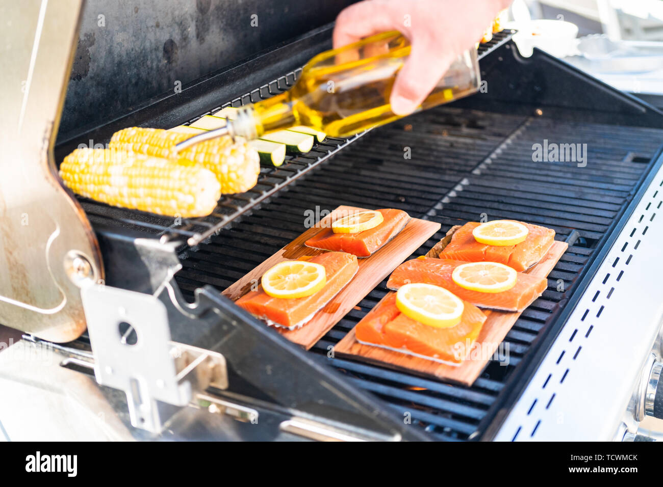 Grilling salmon on gas burning hi-res stock photography and images - Alamy