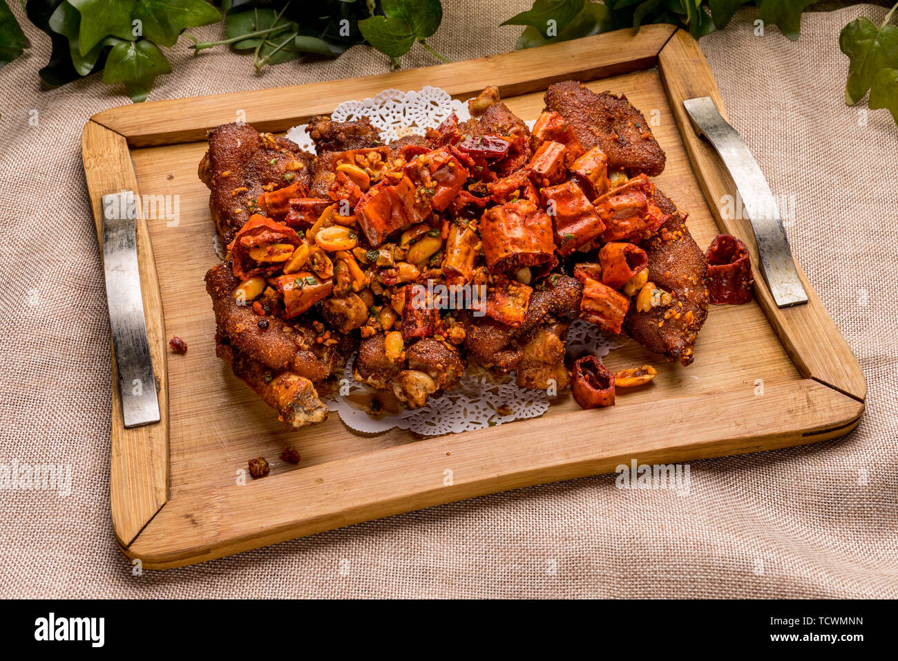 Crispy, spicy, roasted pig's feet Stock Photo - Alamy