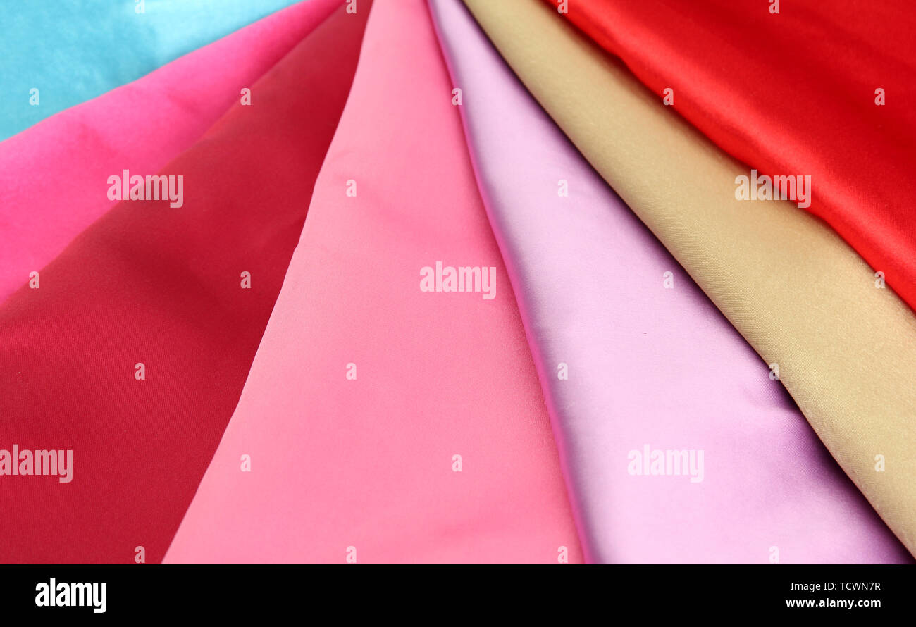 heap of cloth fabrics, close up Stock Photo - Alamy
