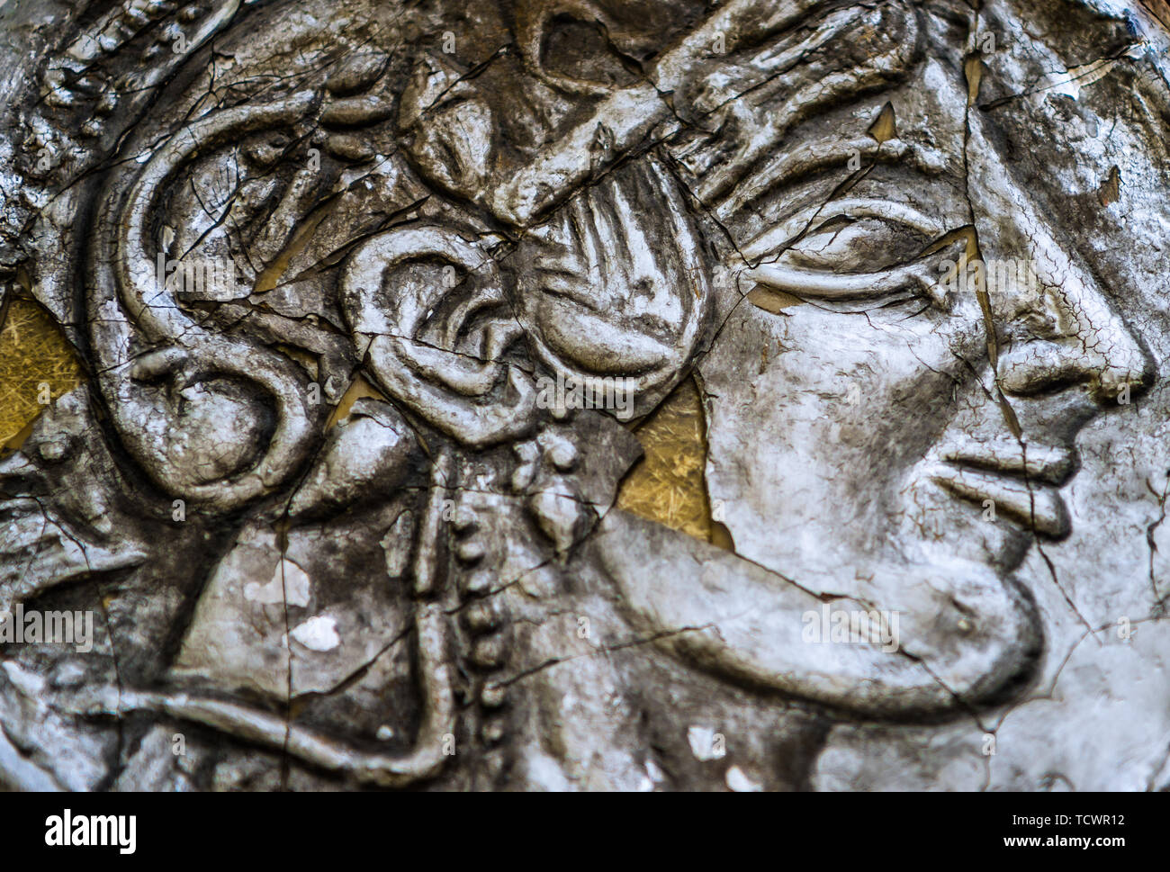 A close-up of Roman avatar statues on broken ancient silver coins ...