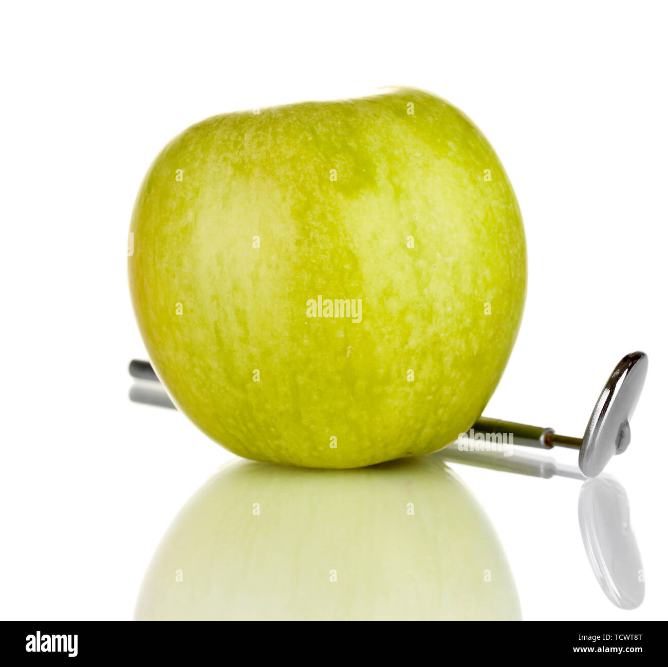 Green apple and dental tool isolated on white Stock Photo - Alamy