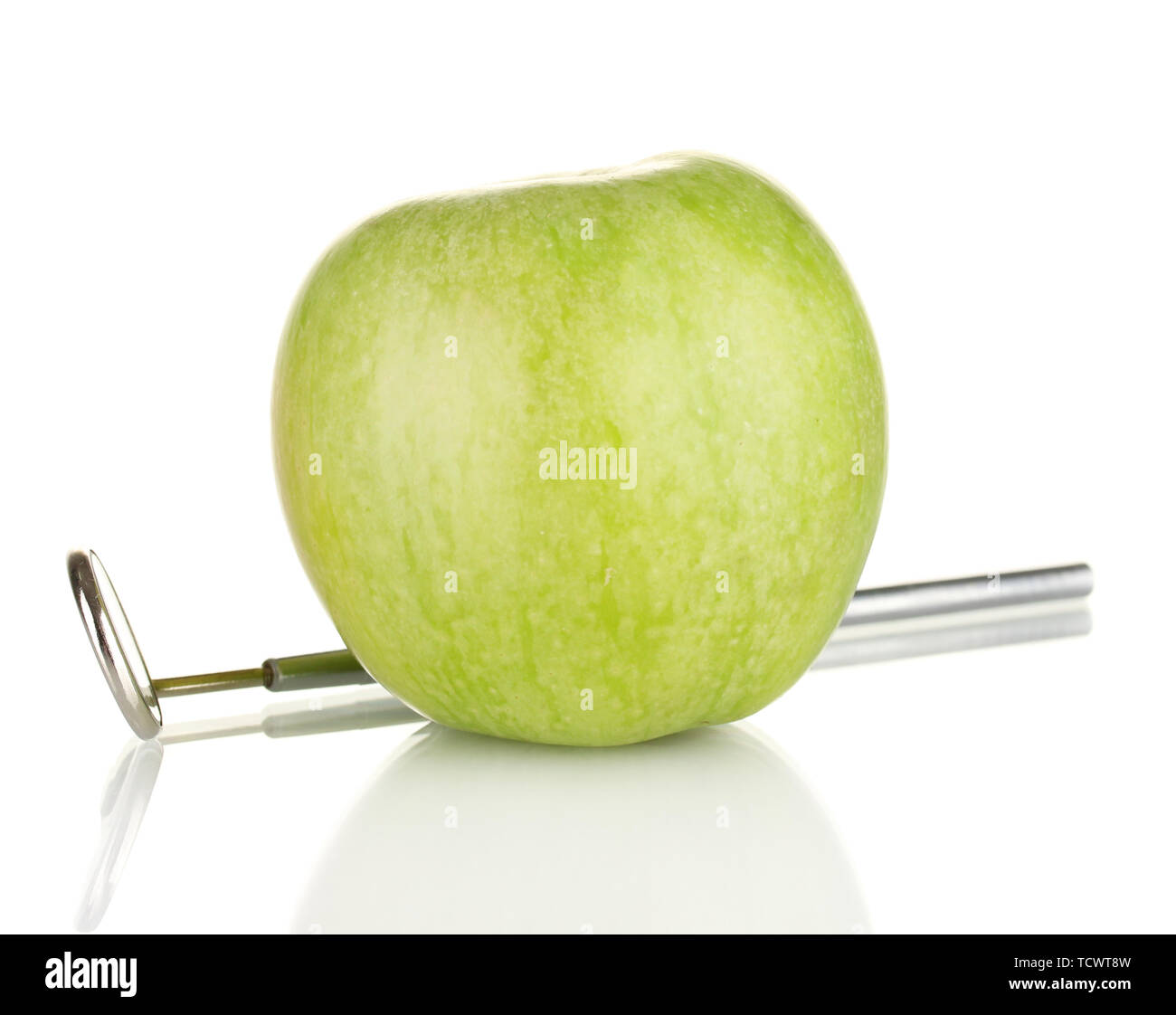 Green apple and dental tool isolated on white Stock Photo - Alamy