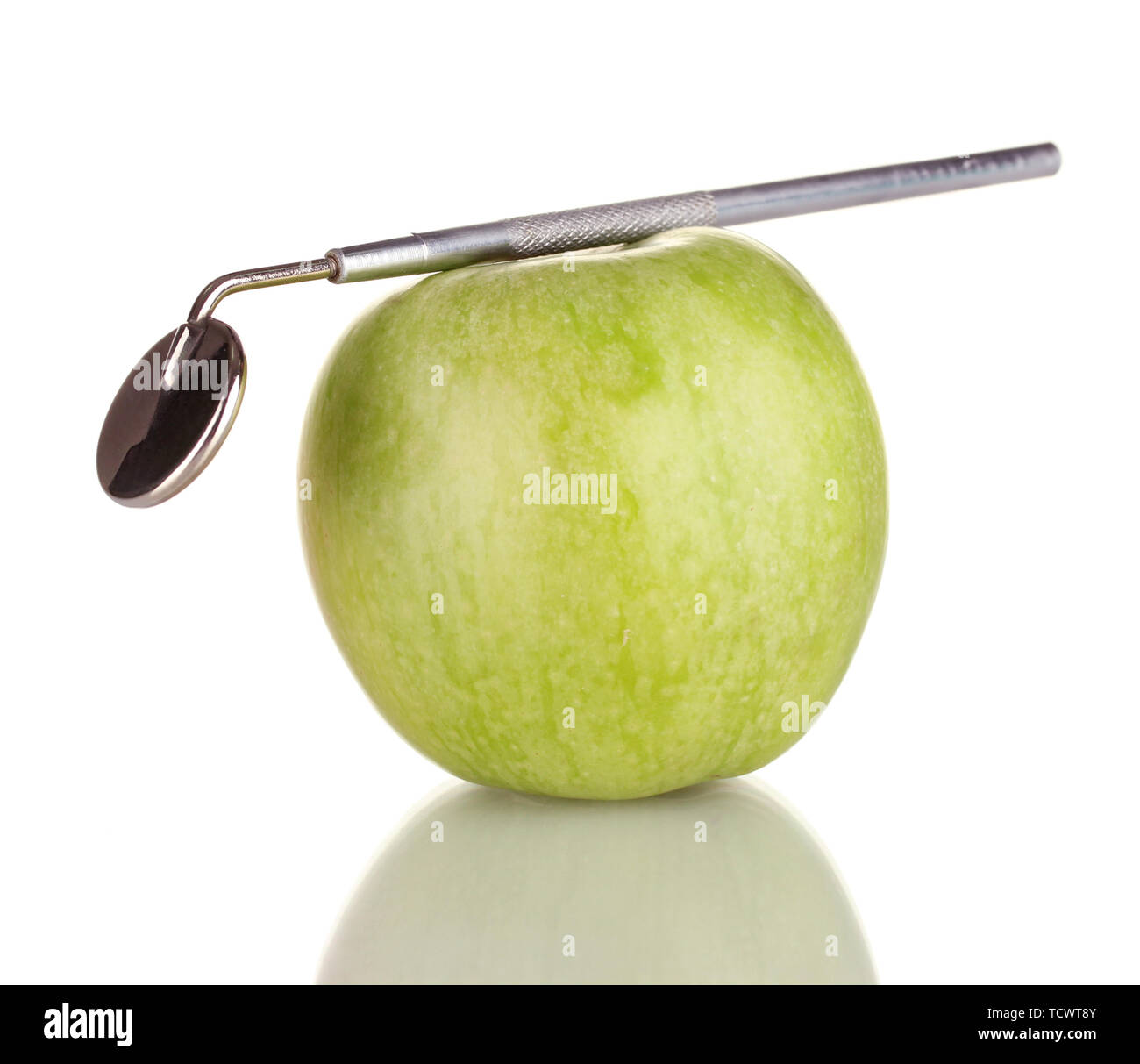 Green apple and dental tool isolated on white Stock Photo - Alamy