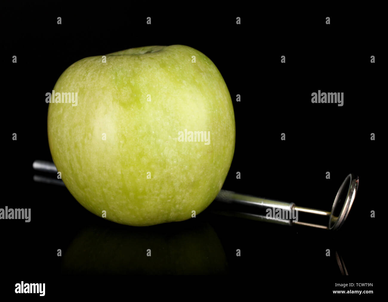 Green apple and dental tool isolated on black Stock Photo - Alamy