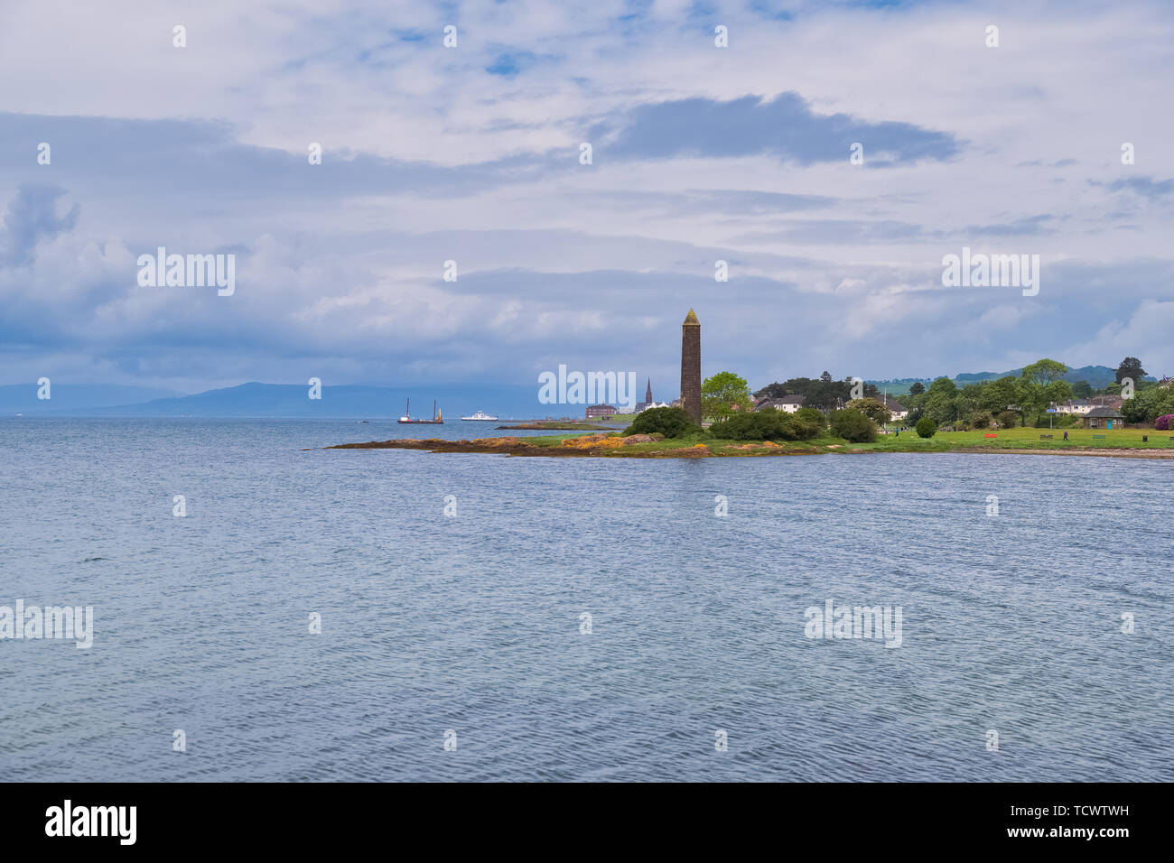 Largs foreshore looking past the Pencil Monument there to commemorate ...