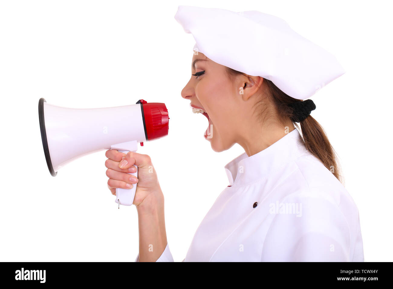 Portrait of young woman chef with megaphone isolated on white Stock ...