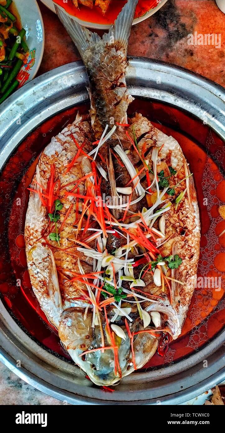 A steamed fish Stock Photo - Alamy