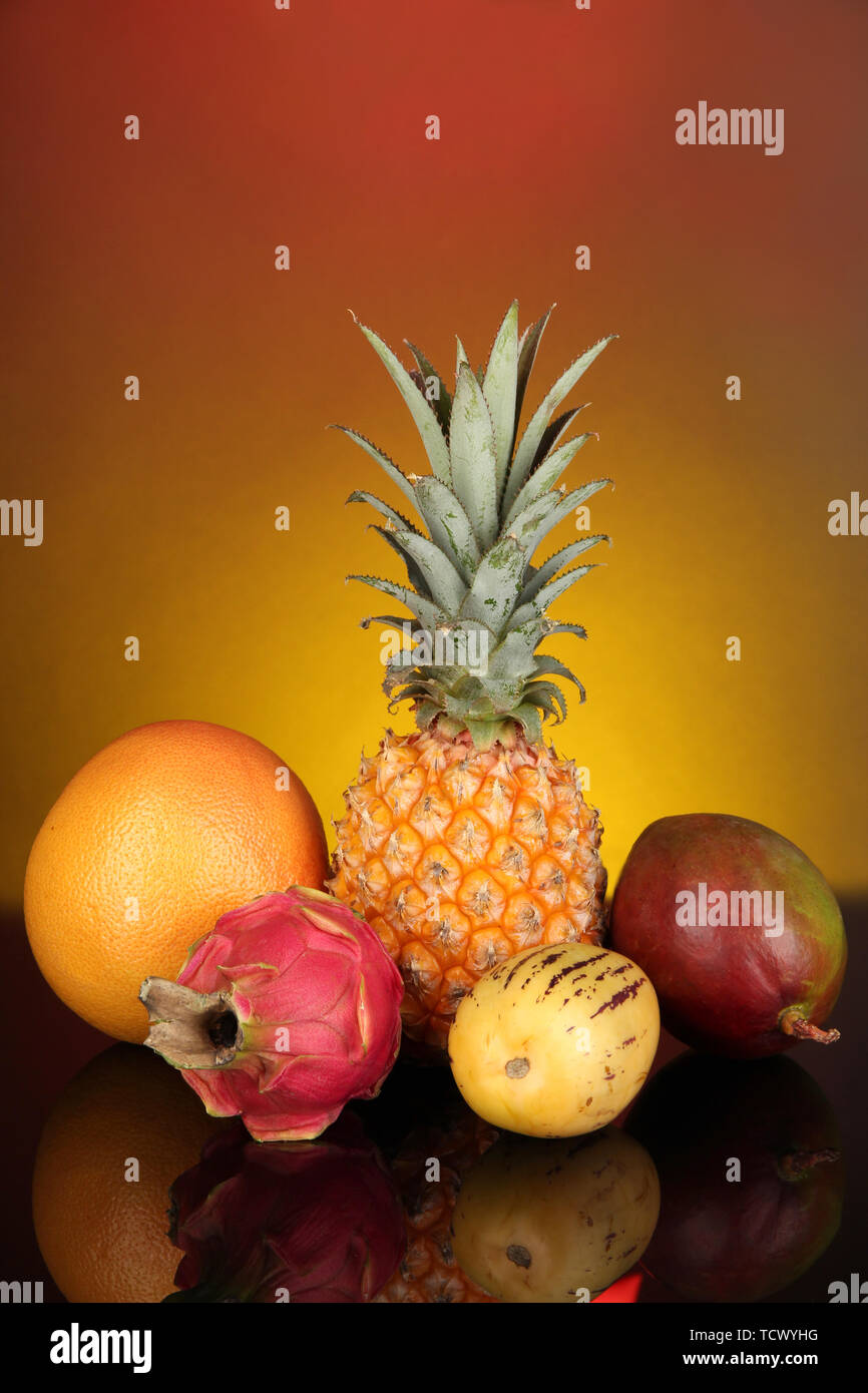 Composition of exotic fruits on colorful background Stock Photo - Alamy