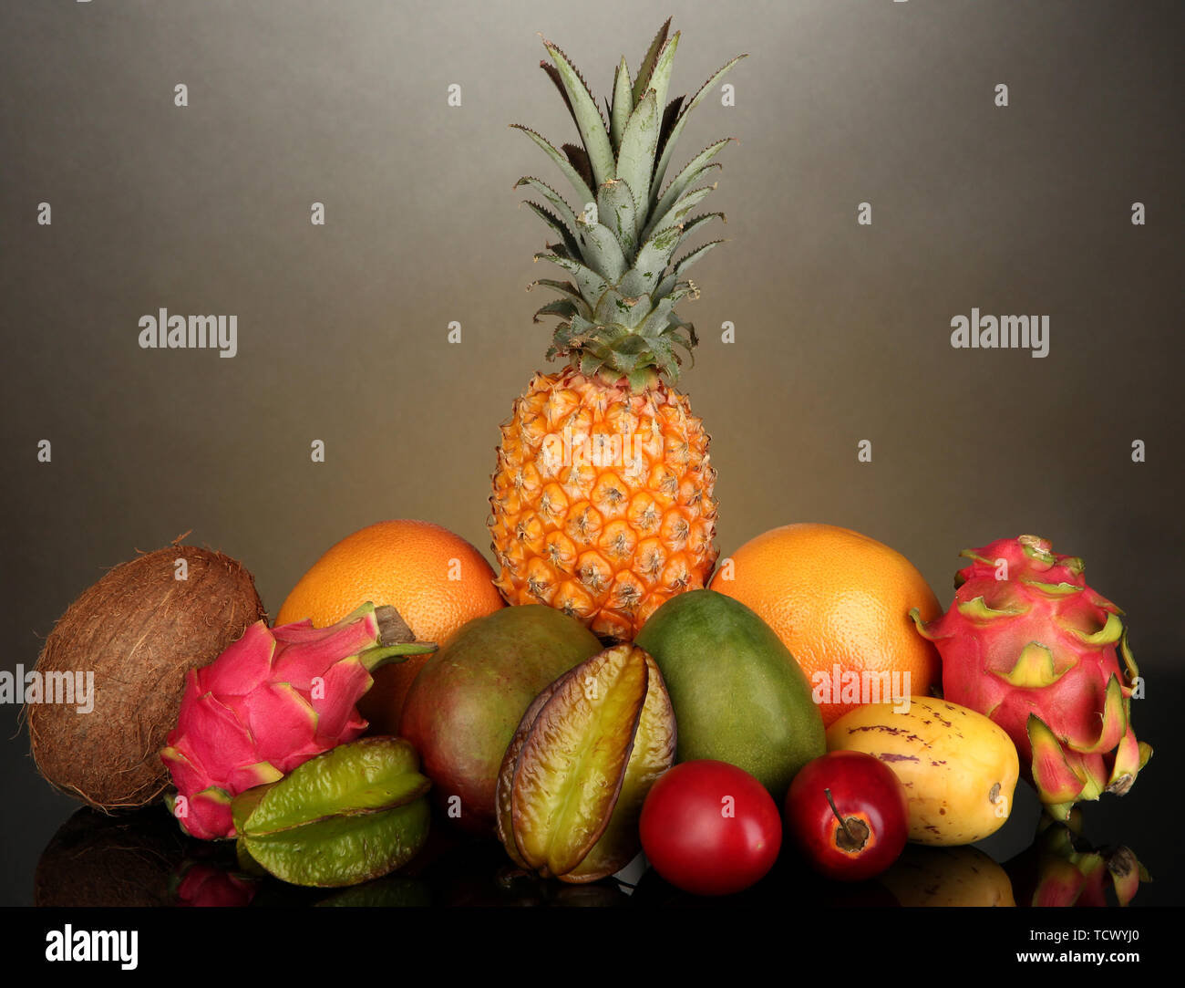 Composition of exotic fruits on colorful background Stock Photo - Alamy