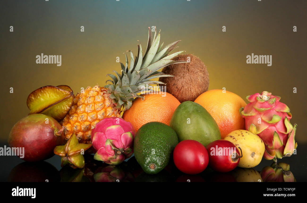 Composition of exotic fruits on colorful background Stock Photo - Alamy