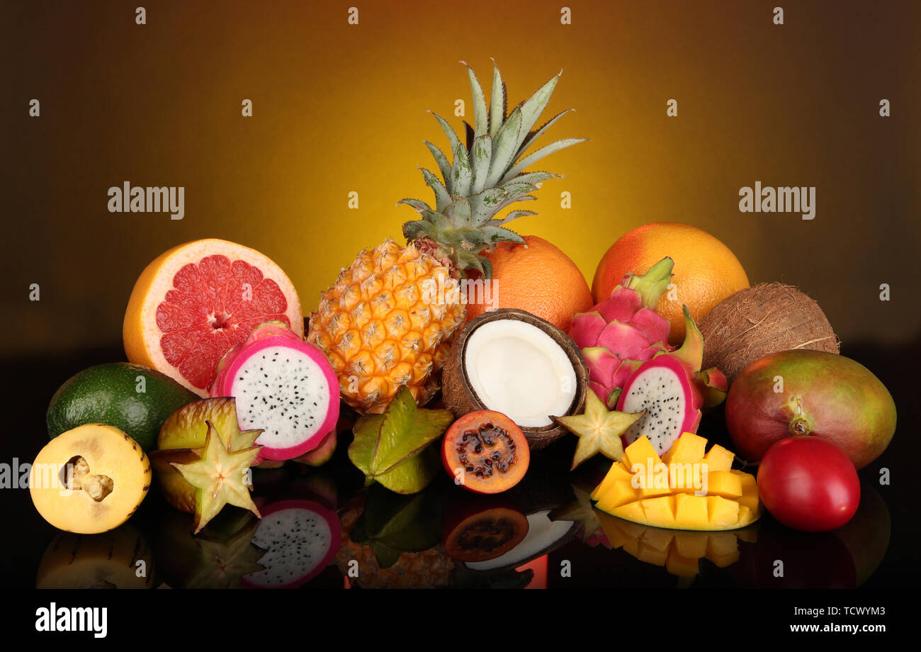 Composition of exotic fruits on colorful background Stock Photo - Alamy