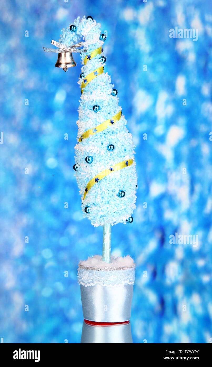 Christmas tree with curved tip on bright background Stock Photo - Alamy