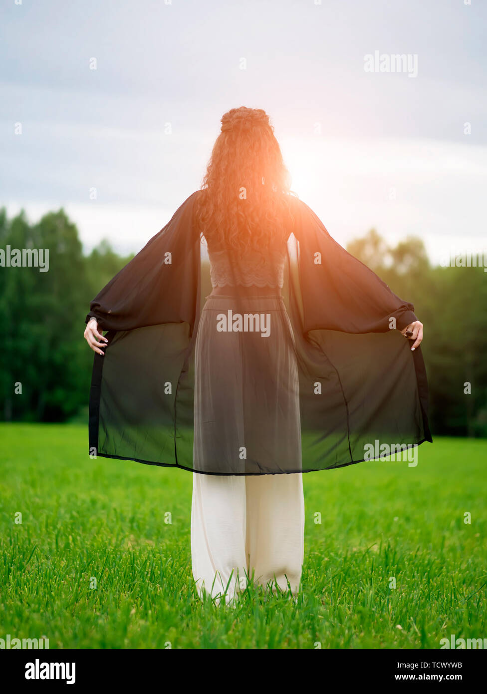 Girl walking across field hi-res stock photography and images - Alamy