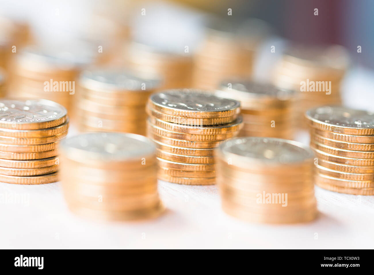 Stacked gold coins Stock Photo - Alamy