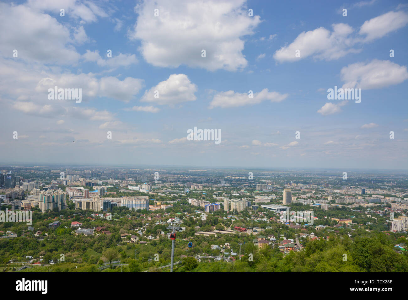 Panoramic view of the city of Almaty, with industrial zone, mountains ...