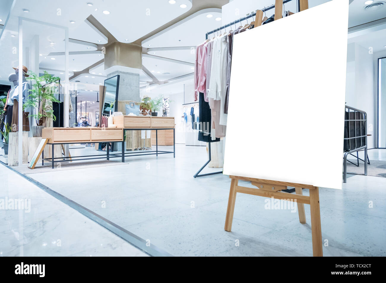 blank bulletin board in modern shopping mall Stock Photo - Alamy