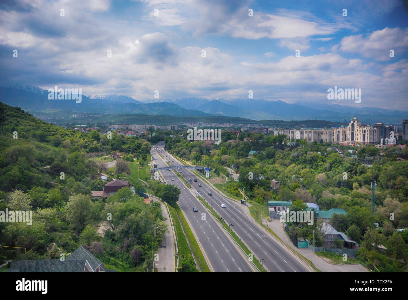 Panoramic view of the city of Almaty, with road, industrial zone ...
