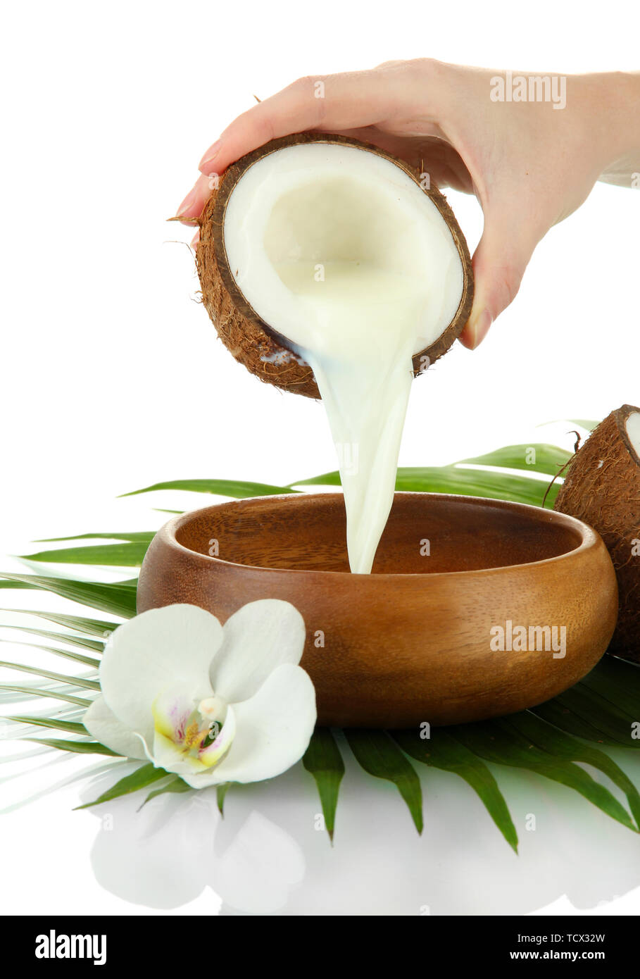 Coconut with coconut milk and leaves, isolated on white Stock Photo - Alamy