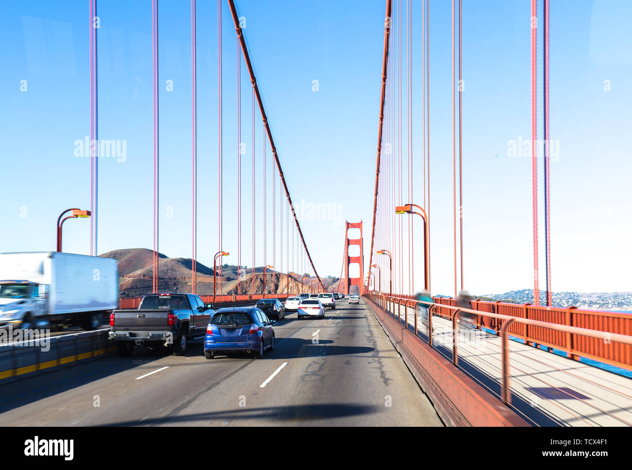 Traffic on gold gate bridge in sunday Stock Photo - Alamy