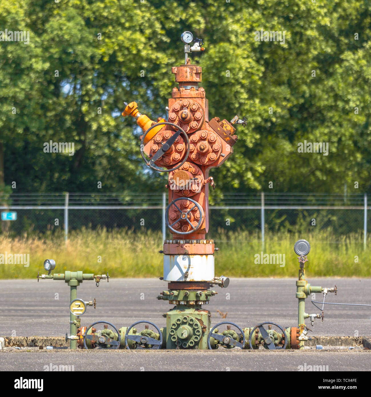 Natural gas wellhead on LNG processing station site Stock Photo - Alamy