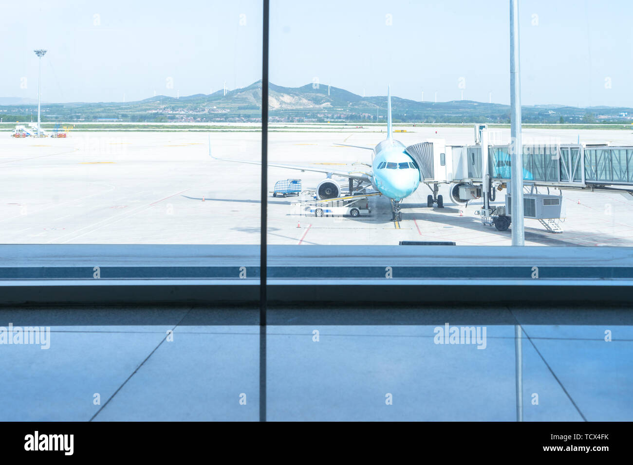 Glass window and photography in airport Stock Photo - Alamy