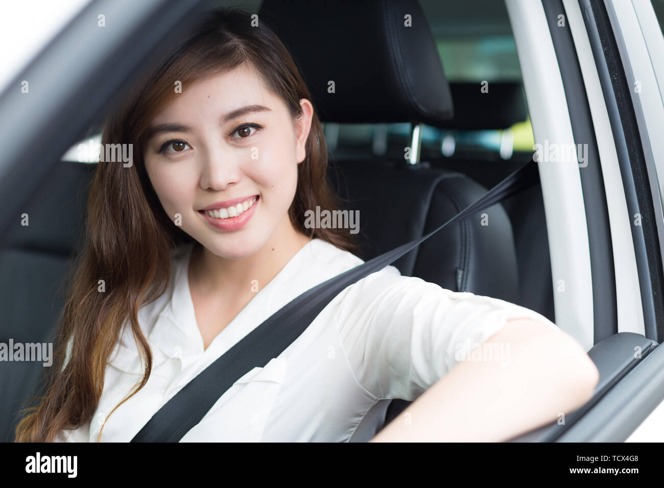 young beautiful asian girl in car Stock Photo - Alamy