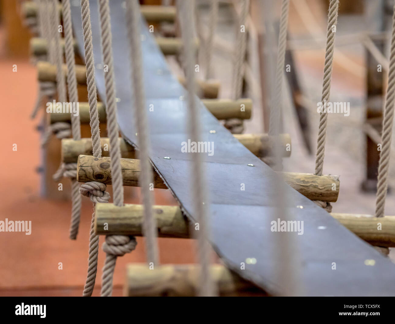 Rope bridge in Indoor adventure park as concept for balance in business ...