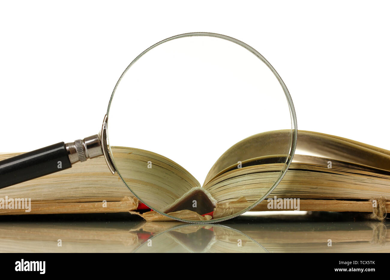 Magnifying glass and book isolated on white Stock Photo - Alamy