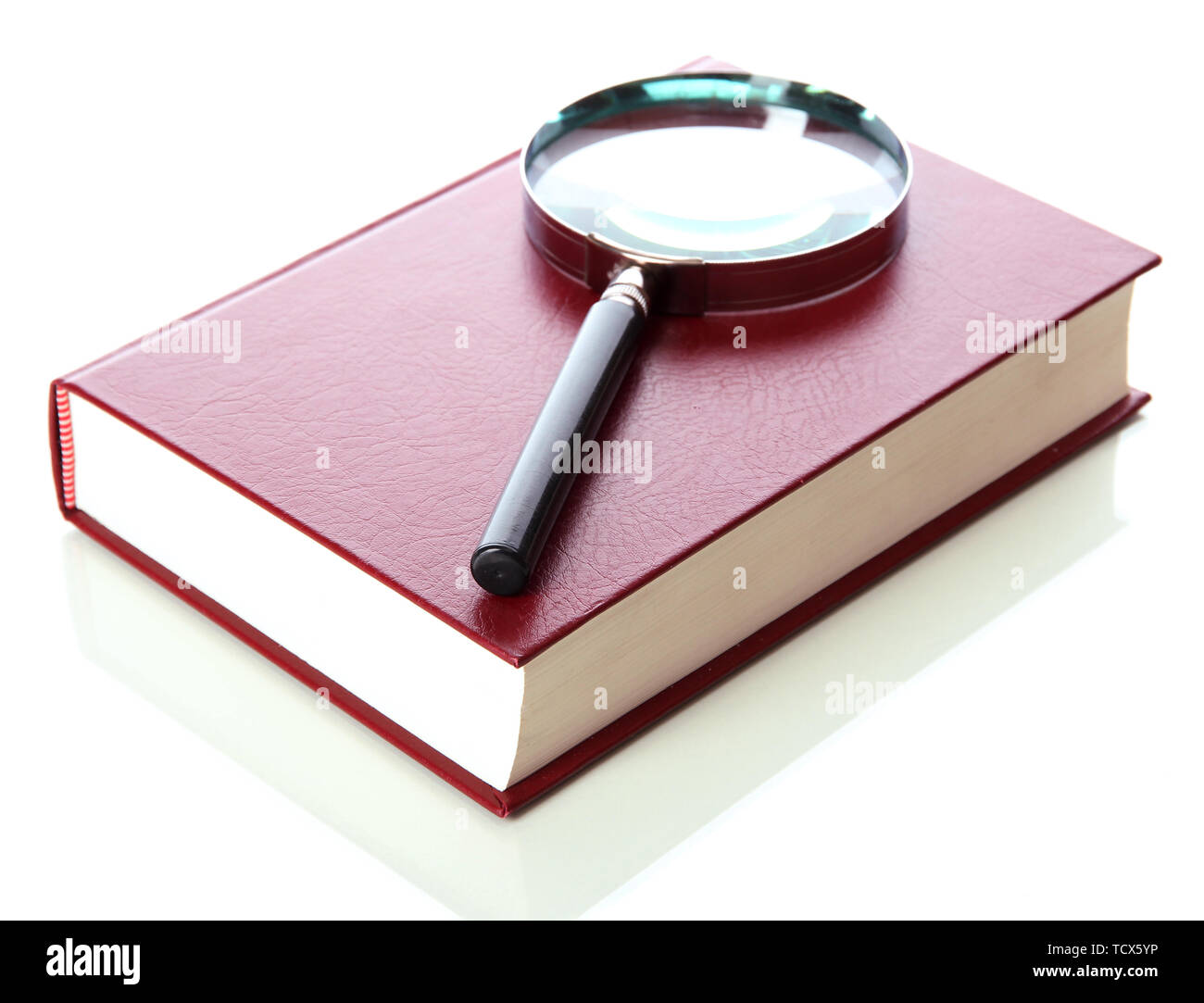 Magnifying glass and book isolated on white Stock Photo - Alamy