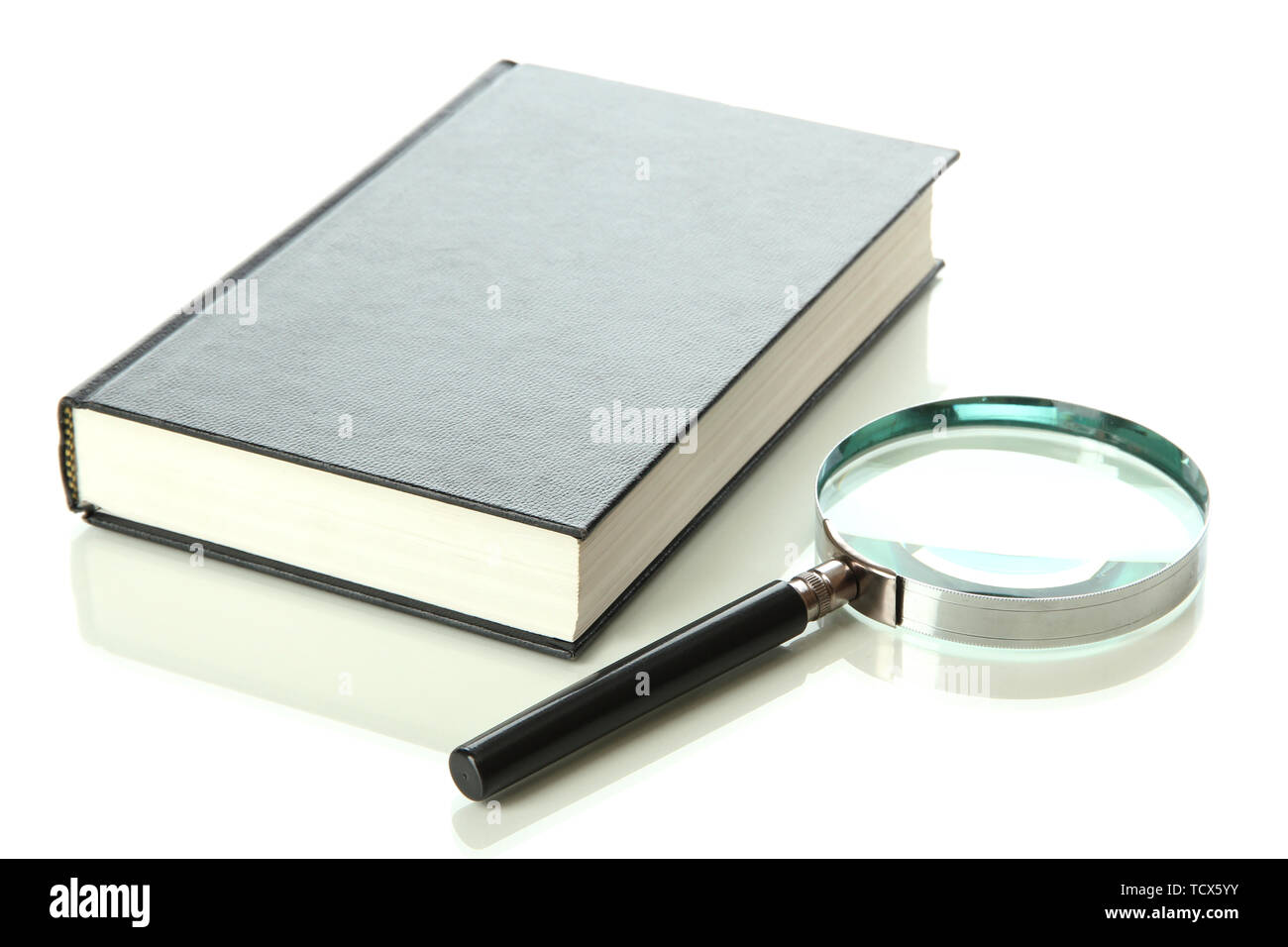 Magnifying glass and book isolated on white Stock Photo - Alamy