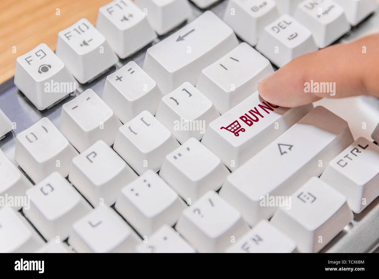 Fingers click on keyboard to buy close-up gestures Stock Photo - Alamy