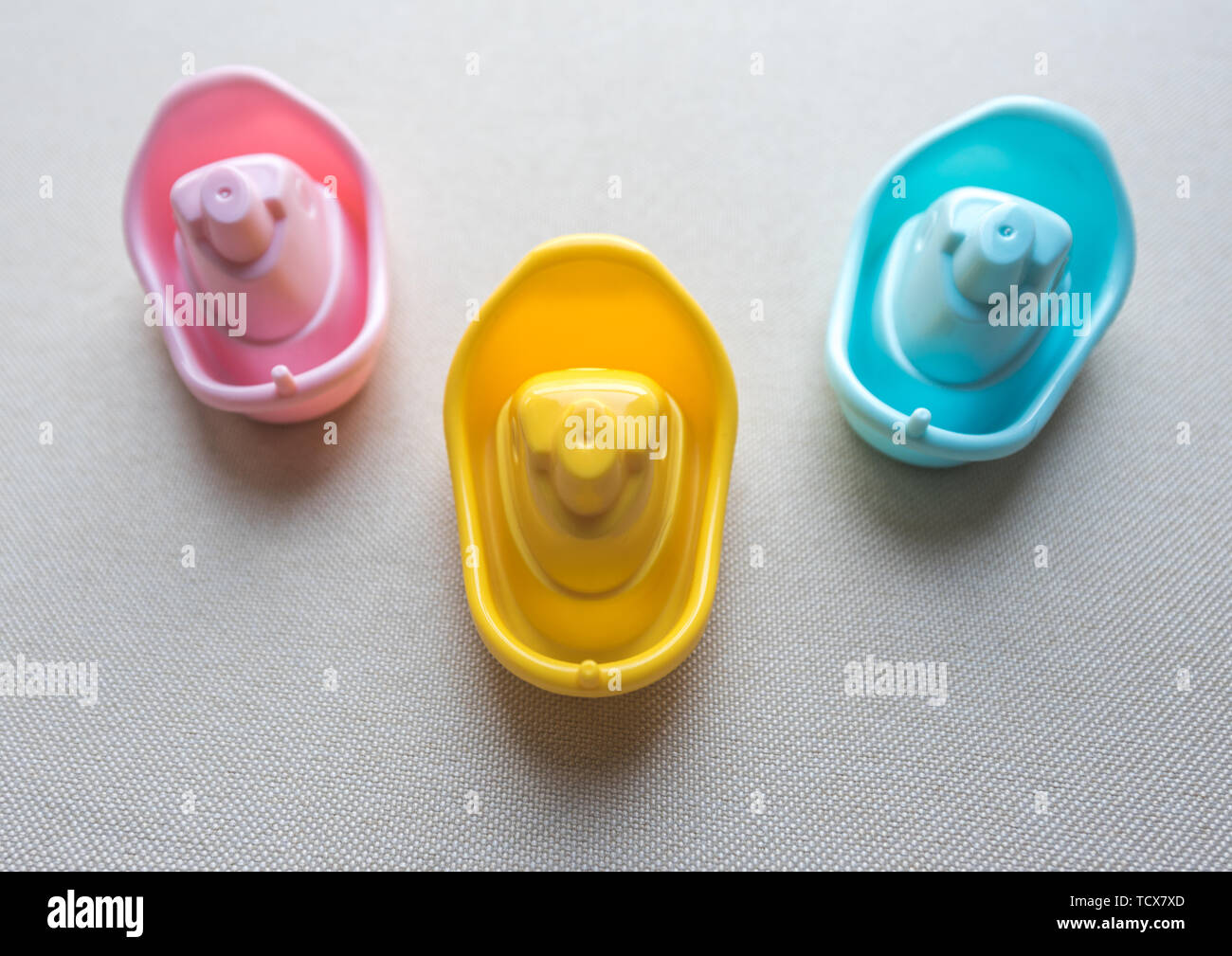 Red, yellow and blue boat toy Stock Photo - Alamy