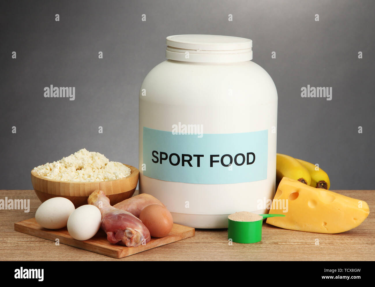 jar of protein powder and food with protein, on grey background Stock ...
