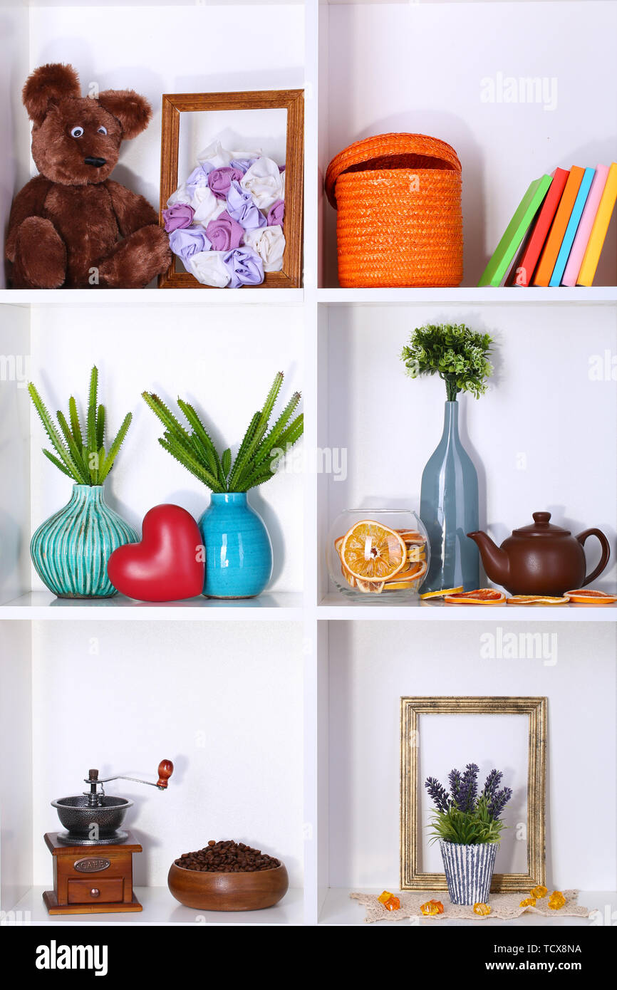 Beautiful white shelves with different home related objects Stock Photo ...