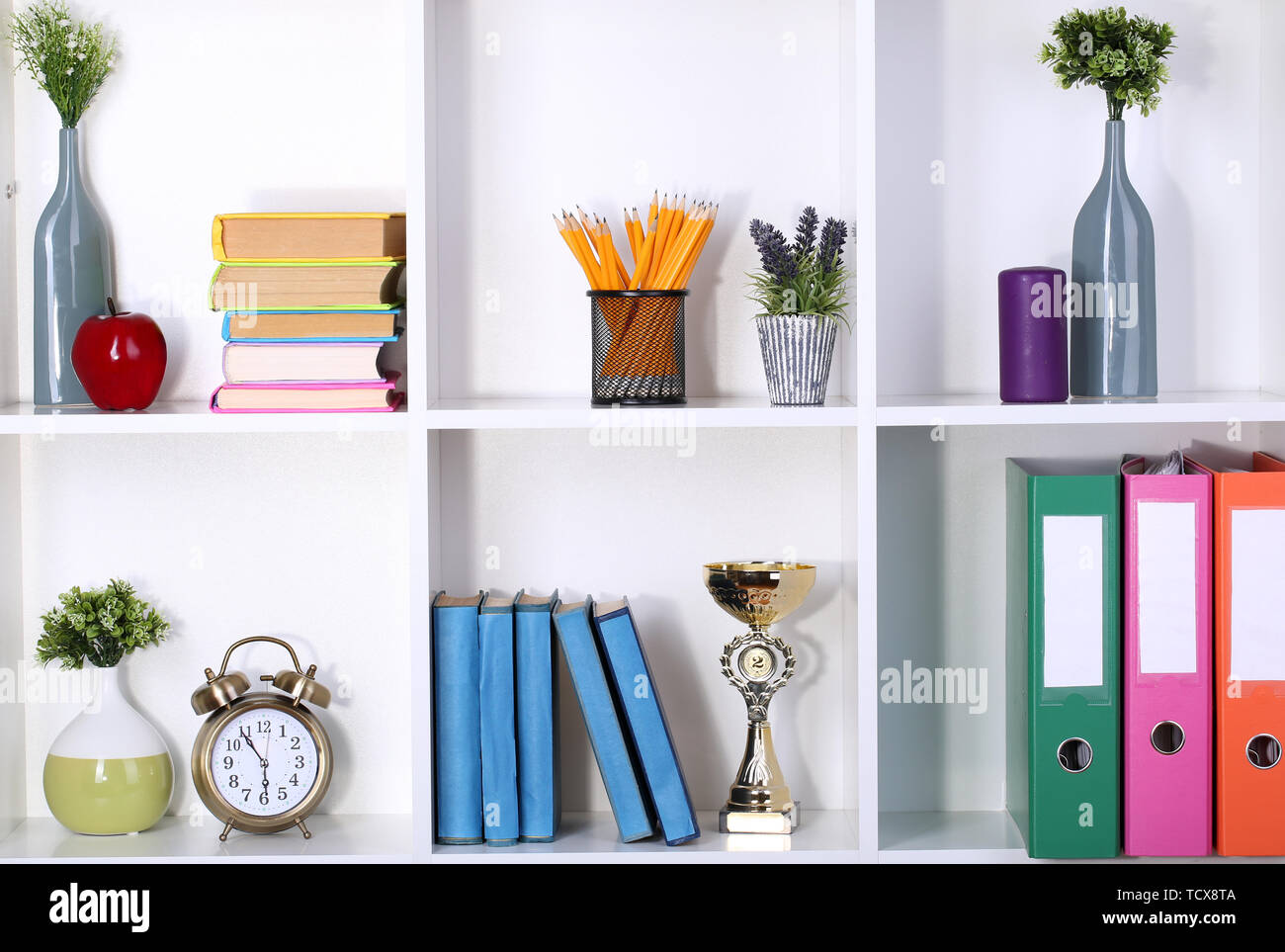 Beautiful white shelves with different home related objects Stock Photo ...