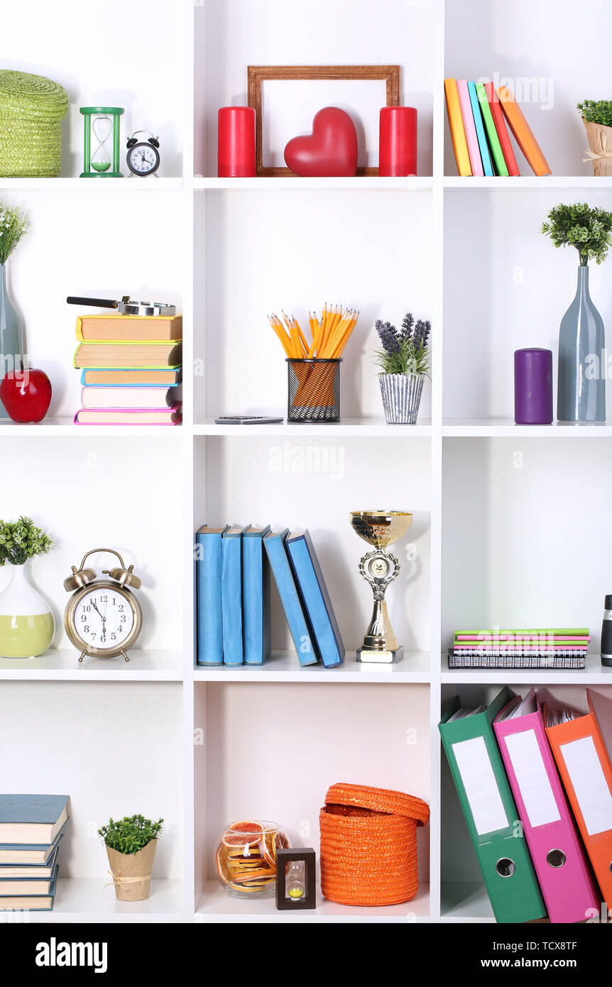 Beautiful white shelves with different home related objects Stock Photo ...
