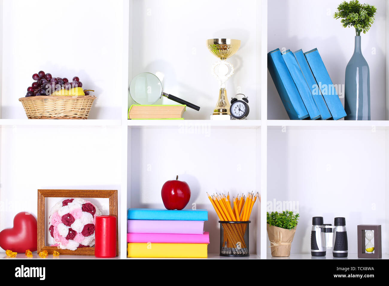 Beautiful white shelves with different home related objects Stock Photo ...