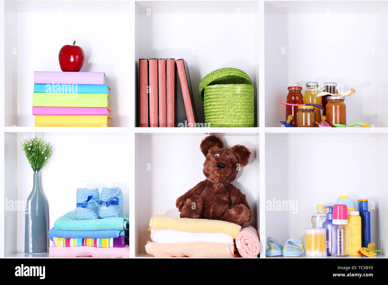 Beautiful white shelves with different baby related objects Stock Photo ...