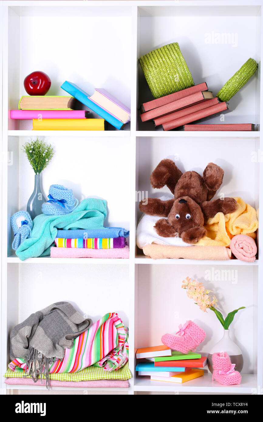Beautiful white shelves with different baby related objects Stock Photo ...